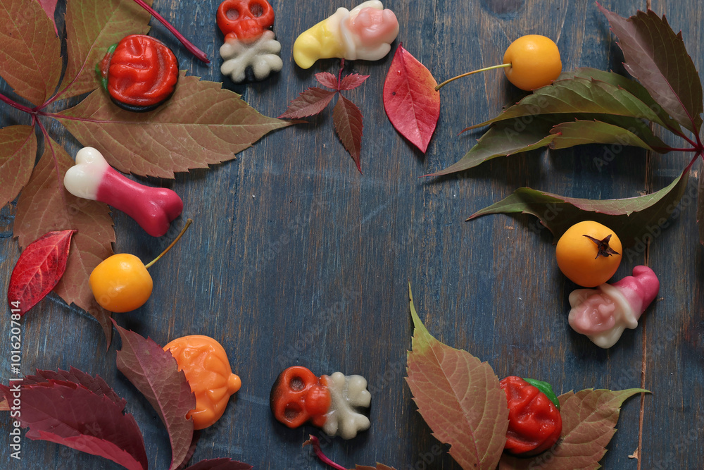 Frame of fall leaves, candy for Halloween. Holidays and food. Dessert ...