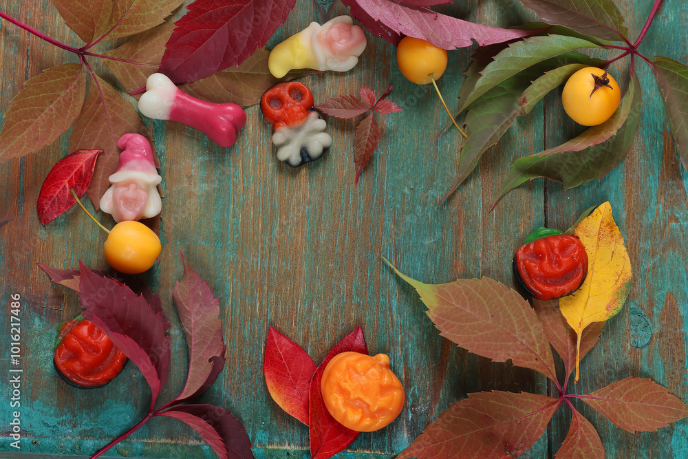 Frame of fall leaves, candy for Halloween. Holidays and food. Dessert ...