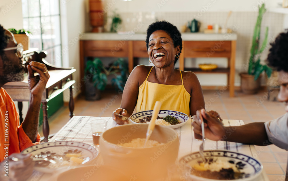 Black family sharing a traditional Brazilian meal together Stock Photo ...