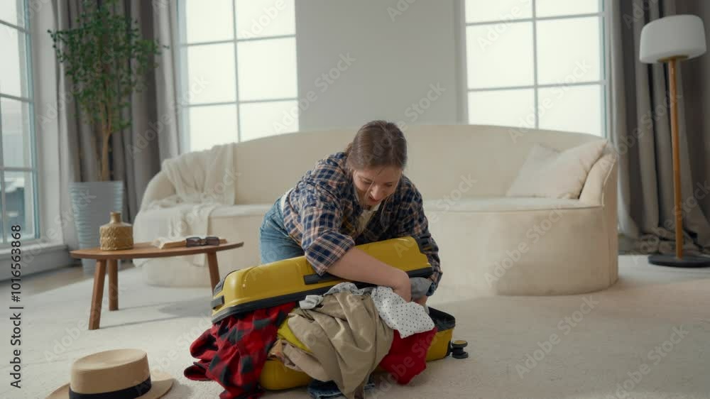 Big suitcase for summer voyage, woman trying to close overloaded bag at ...