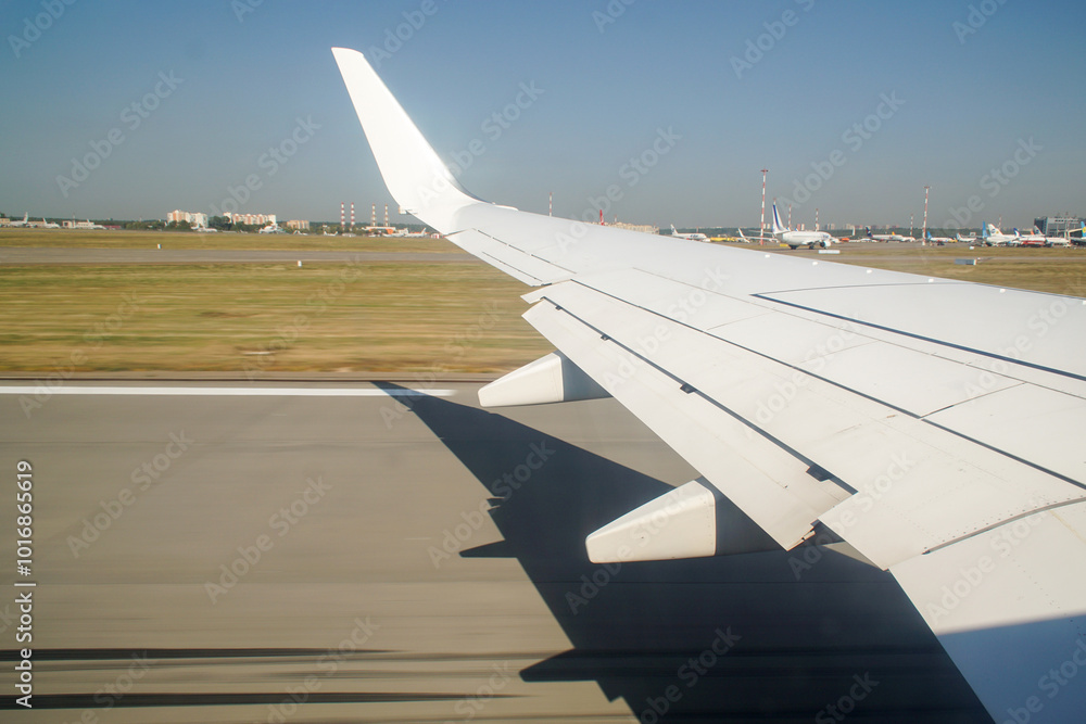 The plane is taking off. View from the window to the wing of the ...