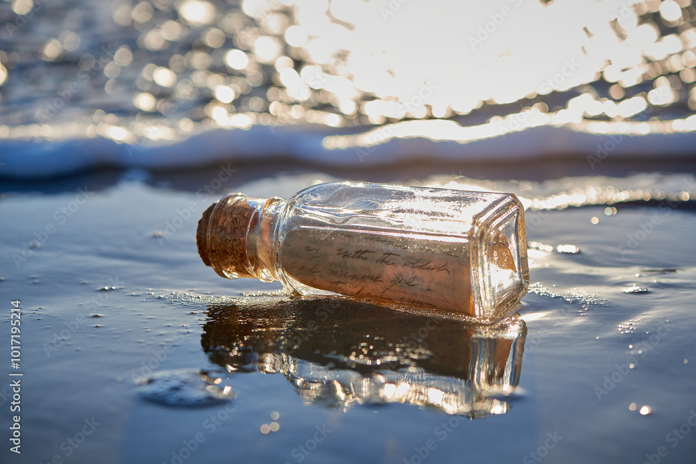 Handwritten letter message in glass on bottle washed up on sand beach ...