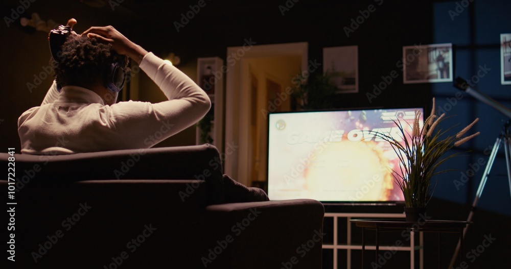 Frustrated gamer raging after getting game over screen, playing on ...