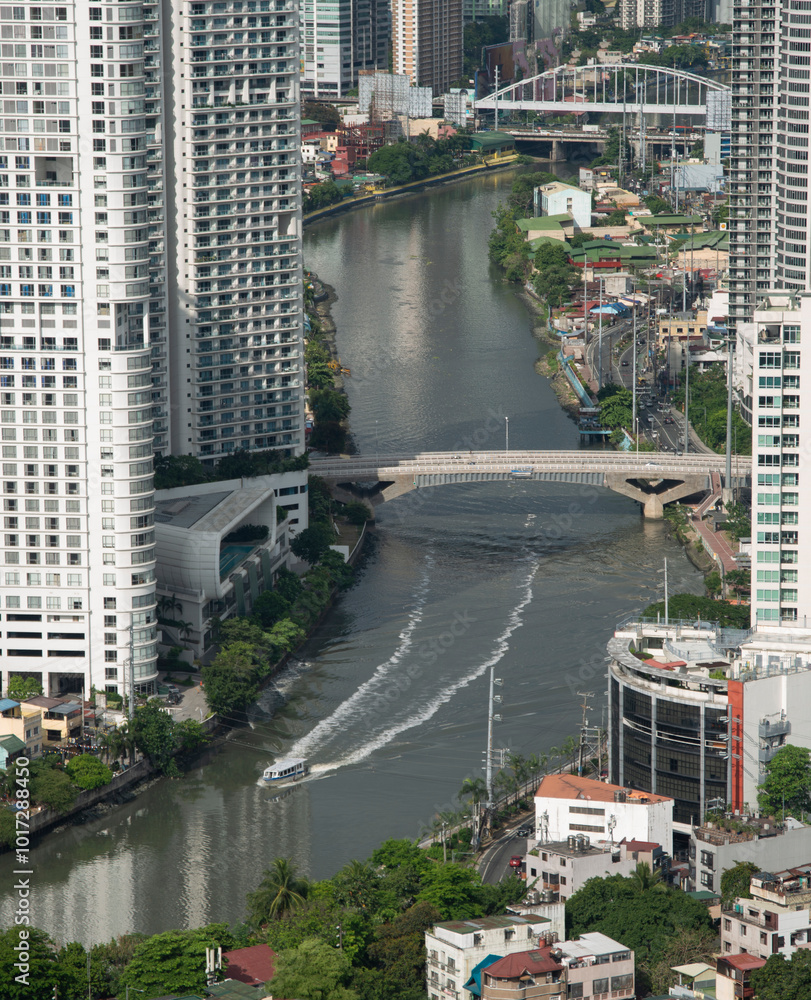 View of Metro Manila and Pasig River,from a high condo building,contrasting with dark clouds ...