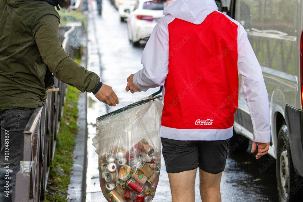 France, 22 May 2024 : People Recycling Empty Soda Cans in Garbage Bag ...
