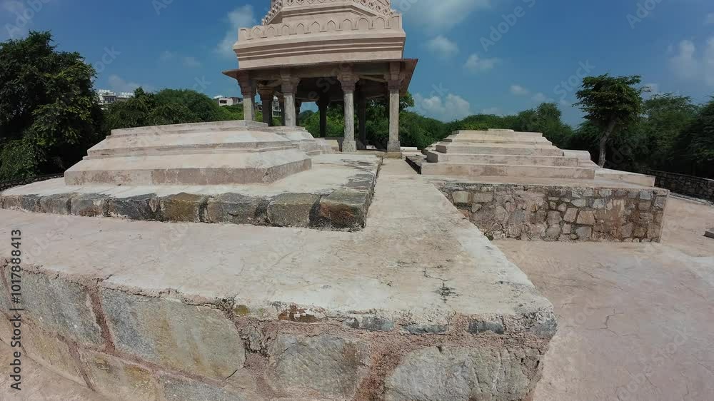 Exploring the beautiful ancient structure amidst lush greenery at ...