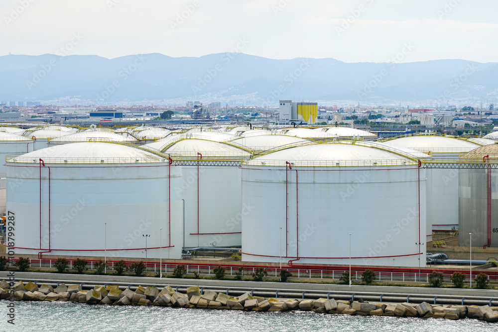 White tanks in tank farm, big silos, tall metal tanks, multiple steel ...