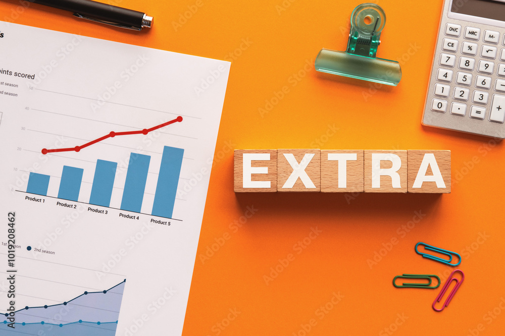 There is wood cube with the word EXTRA. It is as an eye-catching image ...