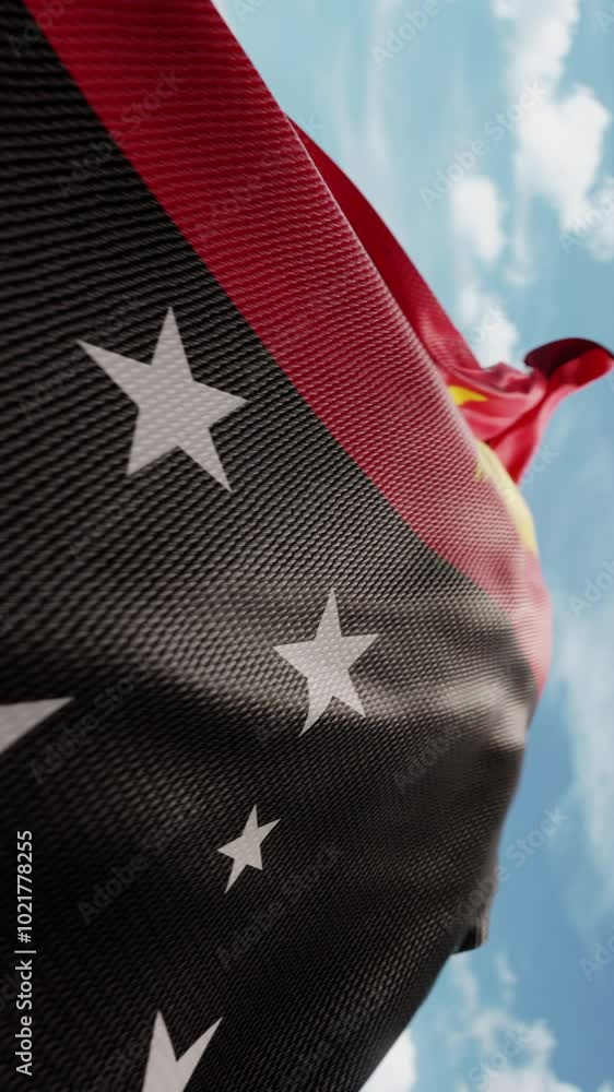 Wavy flag of Papua New Guinea blowing in the wind in slow motion ...
