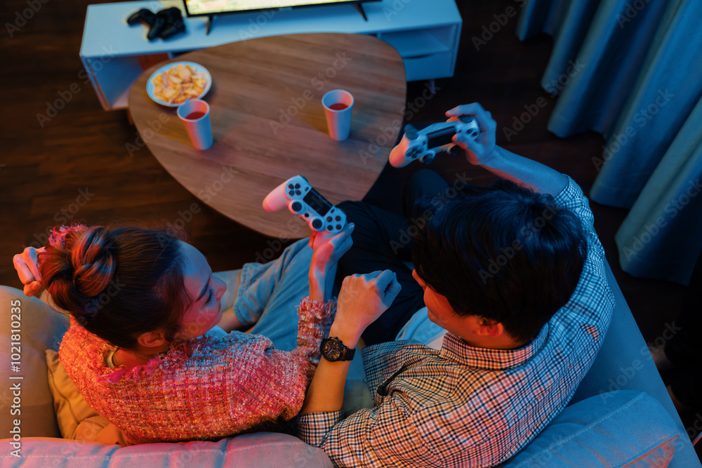 Top view of hands young couple gamer with crashing joysticks, holding ...