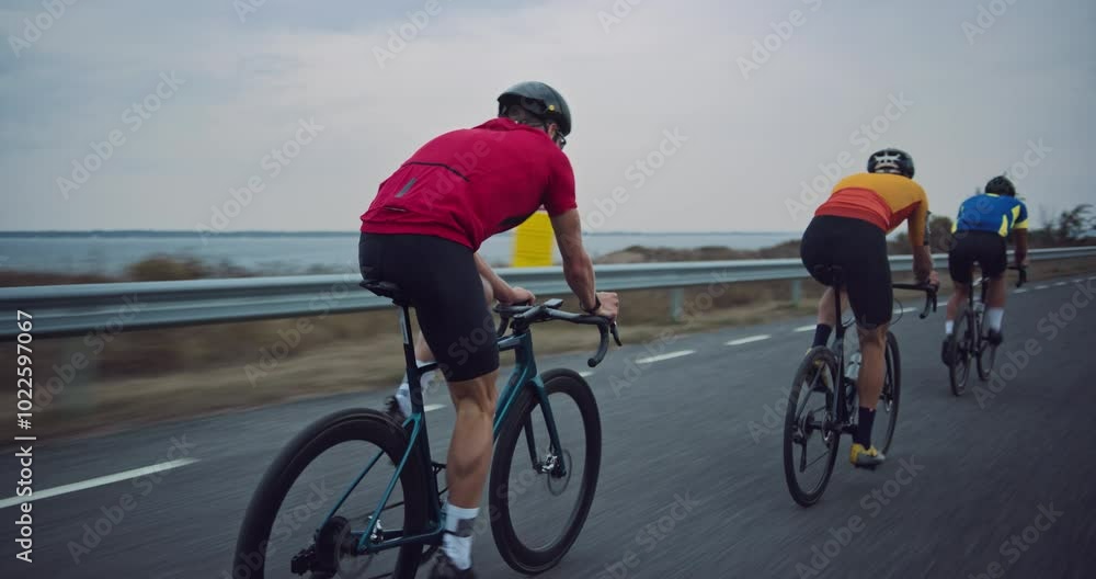 Dynamic Rolling Shot with Cycling Team Powering Through a Country Road ...