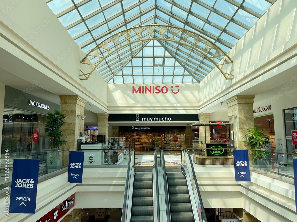 Famous brands and retailer chains in shopping center. Miniso, Muy Mucho ...
