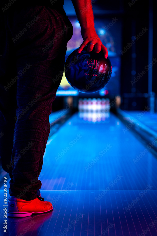 This photo shows a bowler getting ready to throw a strike. The blue ...