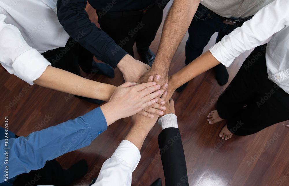 Group of diverse office worker join hand together in office room ...