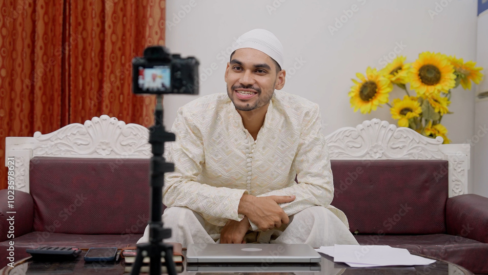 Muslim Content Creator Man Sitting on Sofa and Making Video With Camera ...