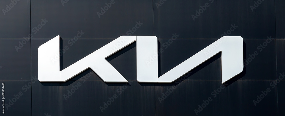 Korean automaker brand KIA. KIA logo on the wall of the office building ...