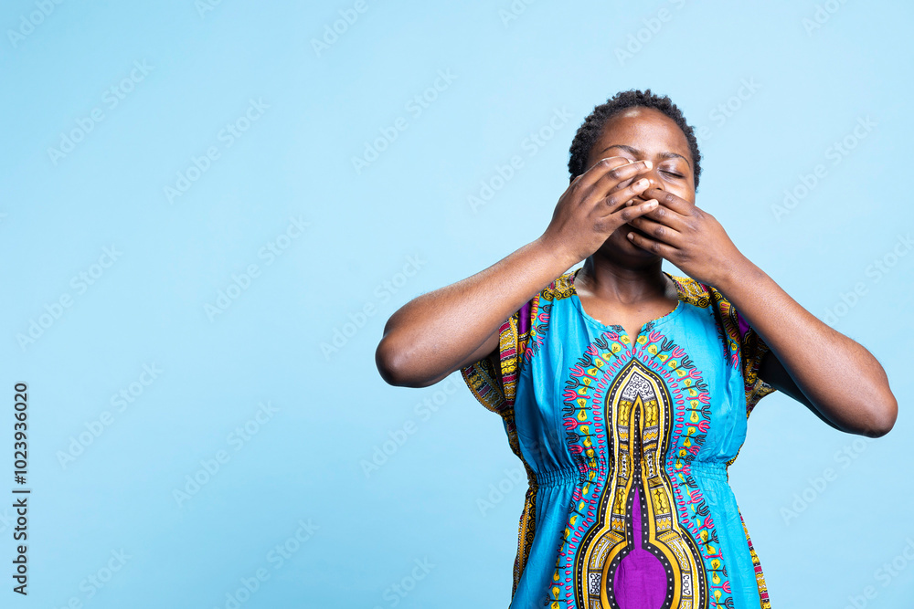 African american woman feeling fatigued in front of camera, yawning and ...