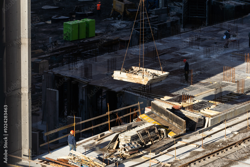 Tower crane on formwork at construction site. Truck mounted concrete ...