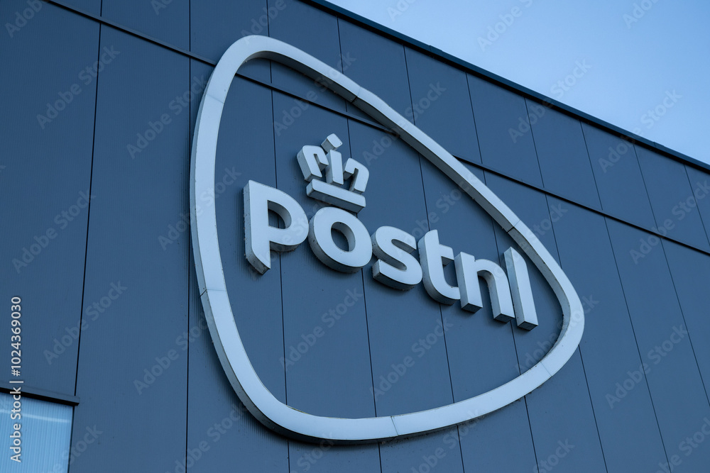 Postnl logo sign on sorting center. The national and biggest postal ...
