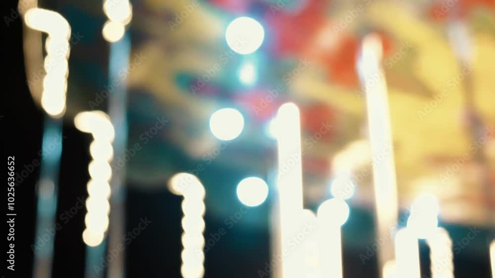 Golden illuminated defocused retro carousel turning in amusement park ...