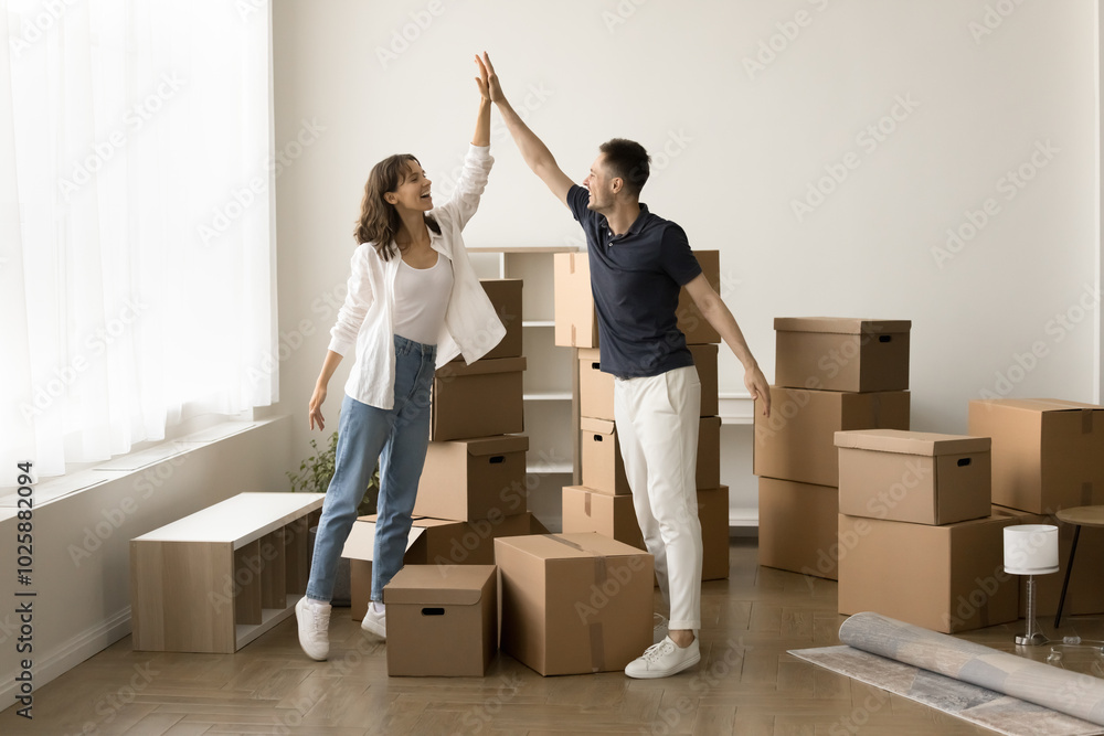 Successful new milestone. Excited young married couple renters tenants ...