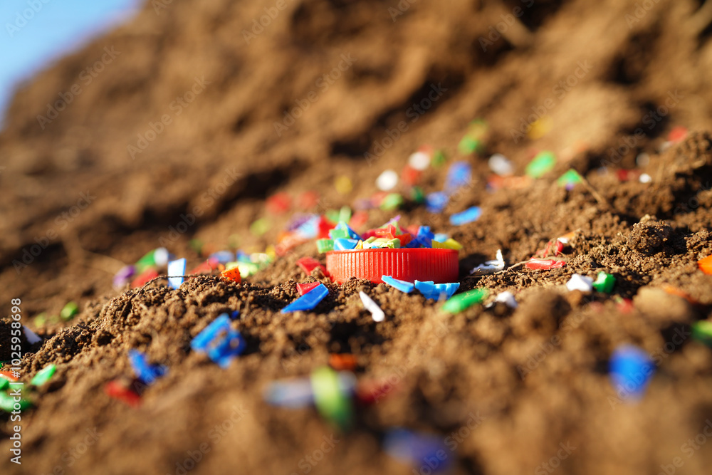 Microplastic pollution. Microplastics in ground. Soil contaminated with ...
