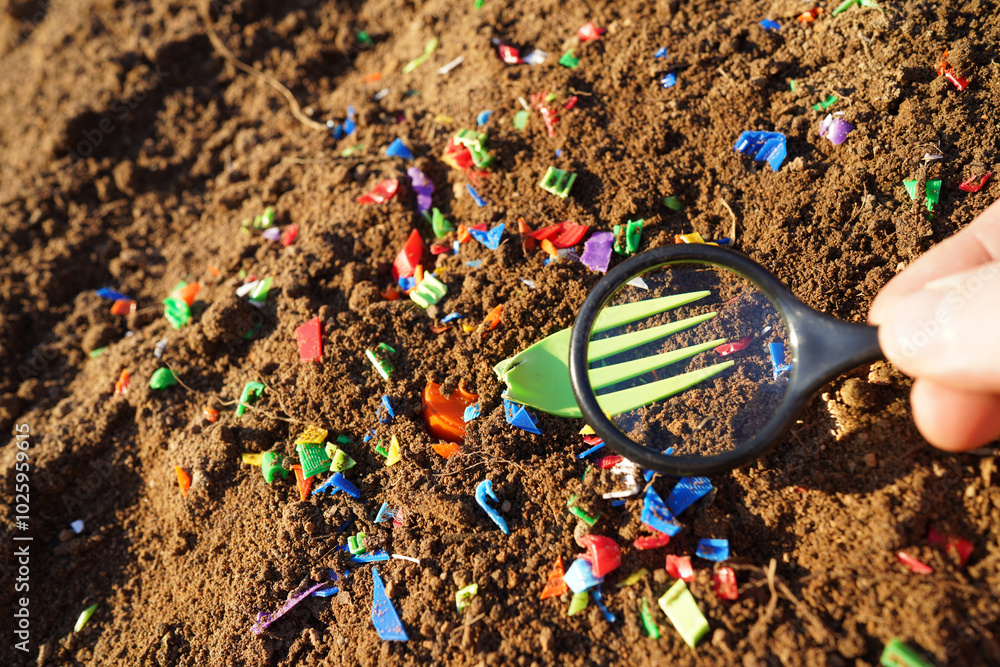 Microplastic pollution. Microplastics in ground. Soil contaminated with ...