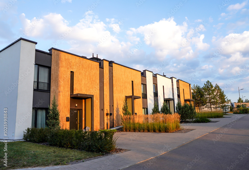 Townhouse in suburb. Modern building in green enviroment. Street with ...