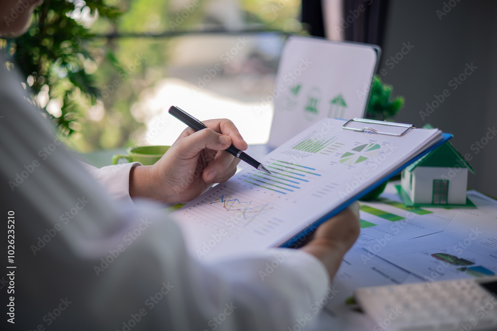 Analyzing green building performance metrics during business meeting ...