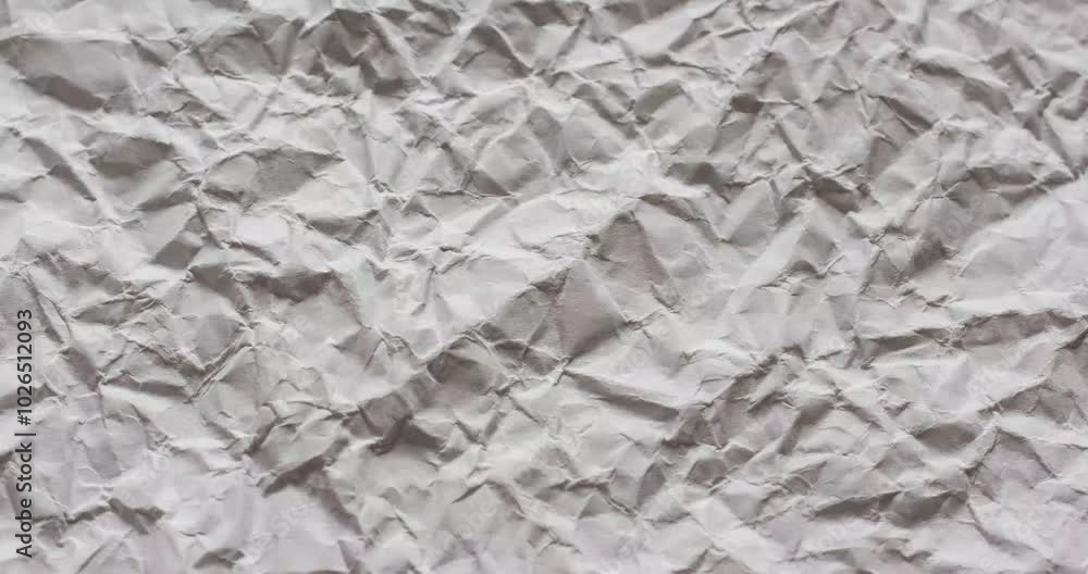 Loop-ready animated crinkled paper texture, showcases subtle creases ...