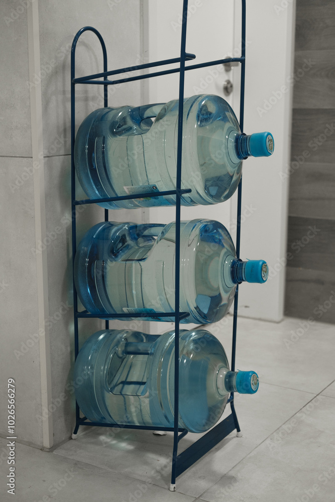 stand with three 20 liter water tanks in a residential building near an ...