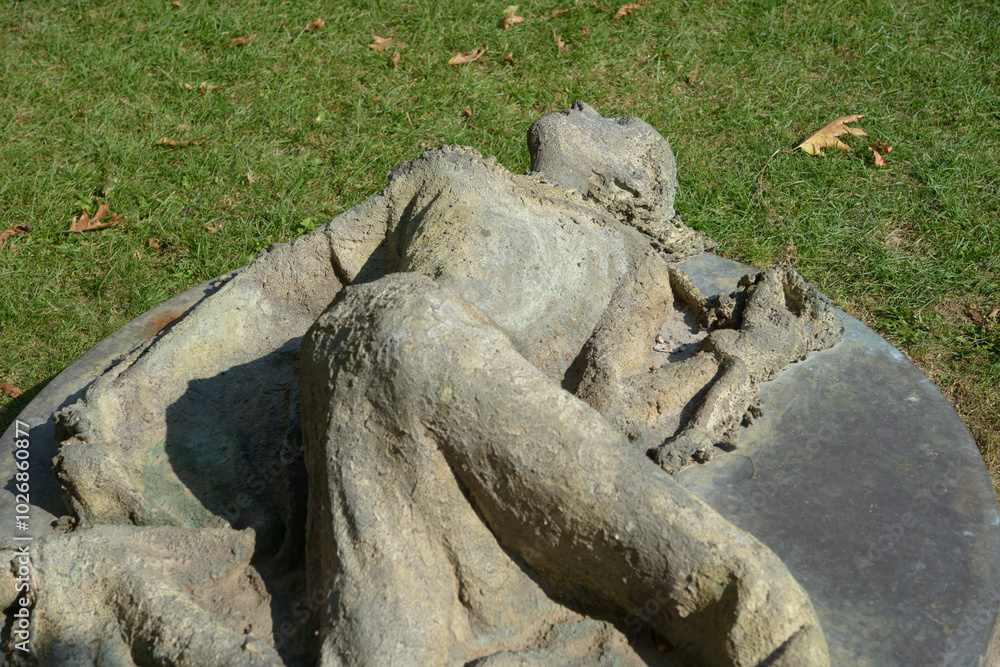 bronze girl on the ground figure by Rowan Gillespie at Ireland Park ...