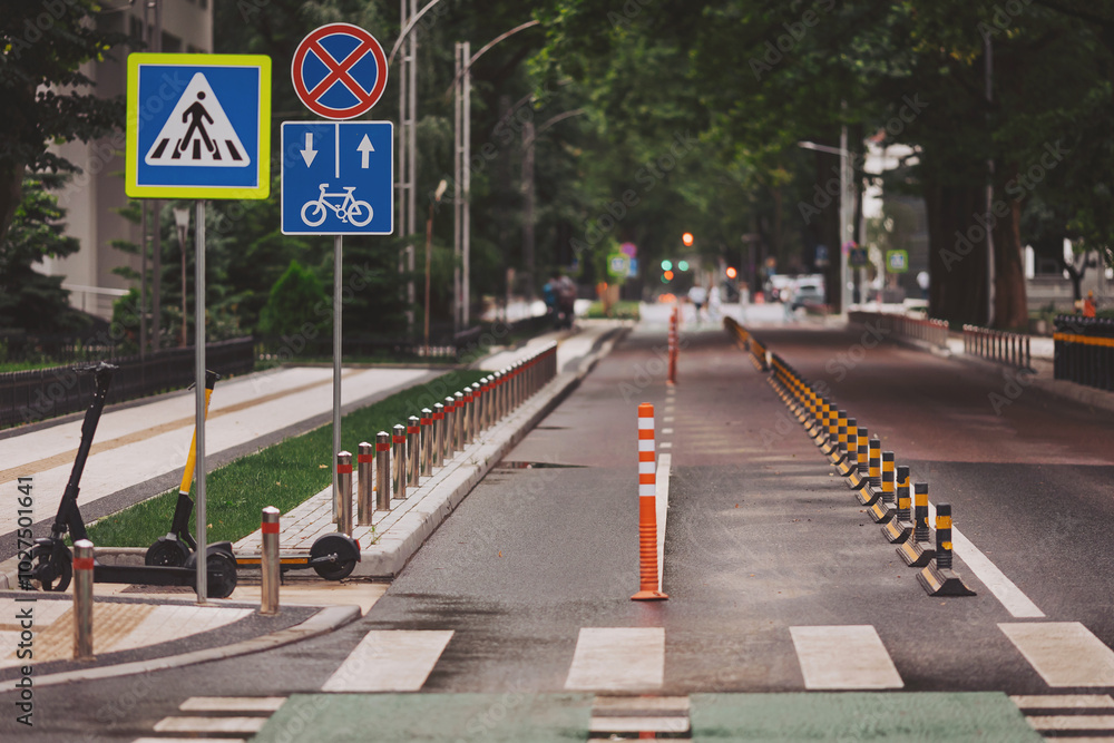 Straight two way cycle lane along side an asphalt road in the middle of ...