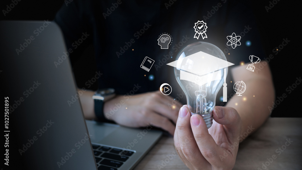 businessman hand holding light bulb with Internet education course ...