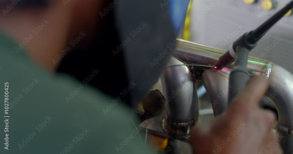 The mechanic is build custom exhaust headersCar pipe welding.The hand ...