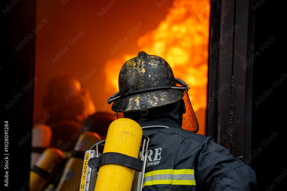 Firefighter Rescue team training in fire fighting extinguisher ...