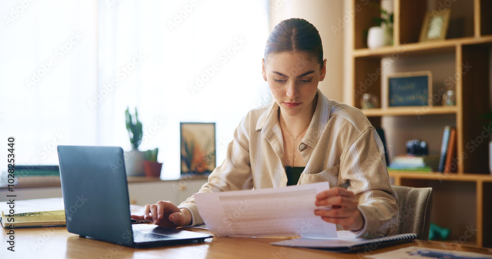 Woman, reading and document with laptop at house for loan approval ...