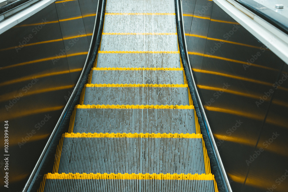 Escalator steps close-up. Descent into the subway. Deep tunnel. Public ...