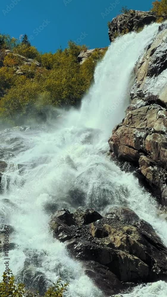 A large, powerful, beautiful waterfall in the mountains. Caucasus ...