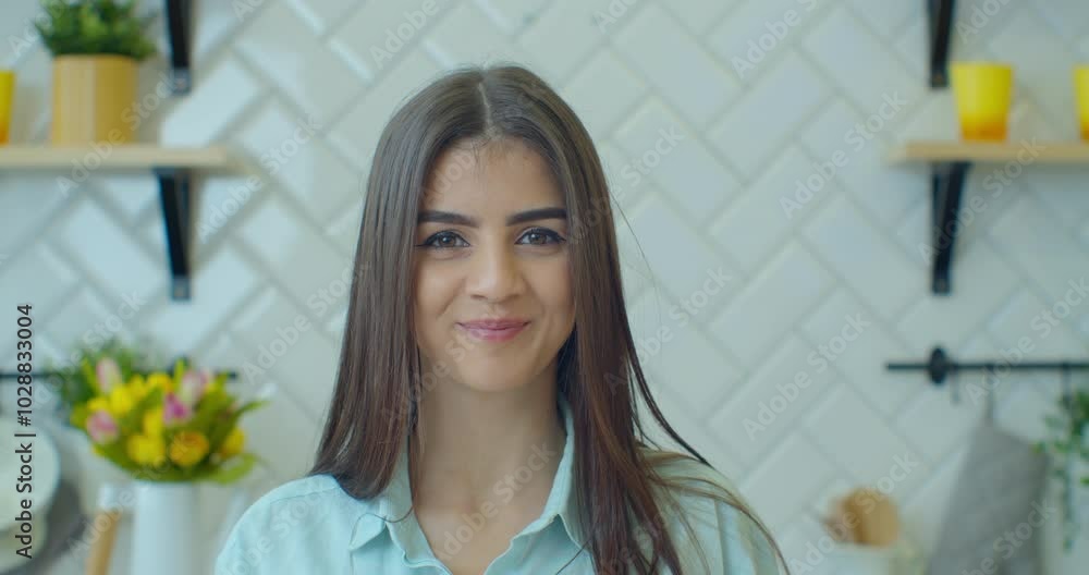 Beautiful and young woman pretty face looking at camera posing alone at ...