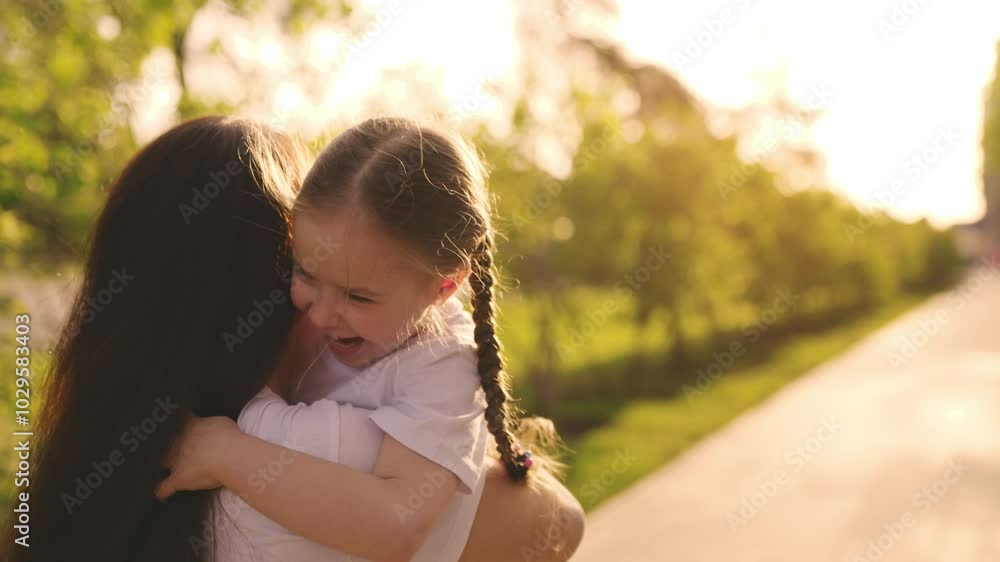 little child runs hug his mother. happy family. mom daughter child ...