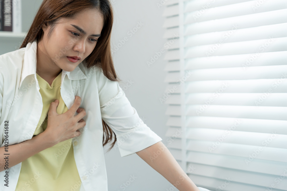 hand hold chest with heart attack symptoms, asian woman working hard ...