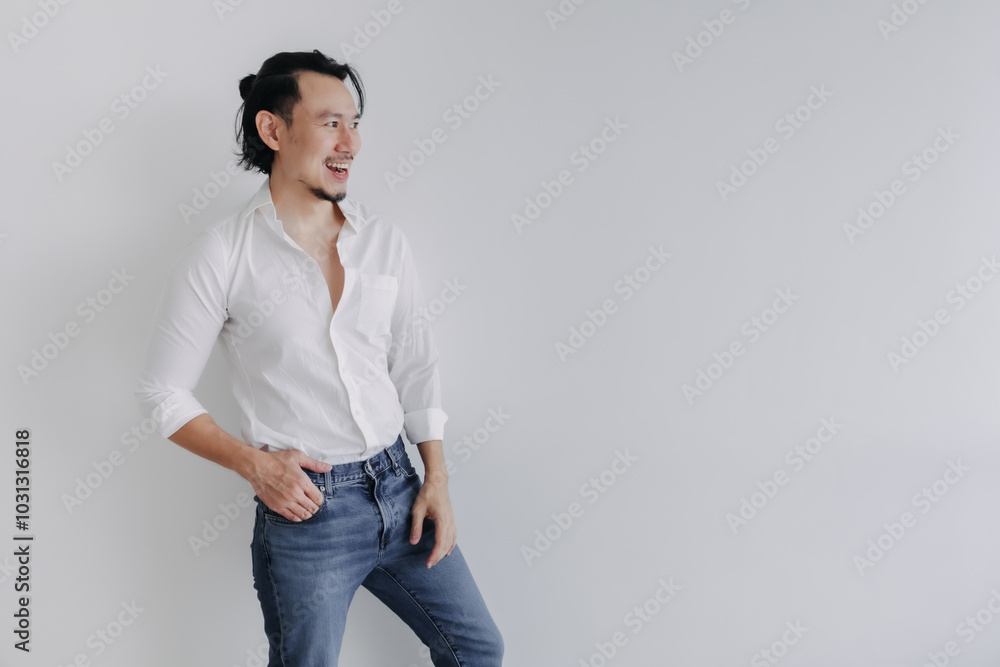 Happy face long hair Asian man bun in white shirt and jean stand on ...