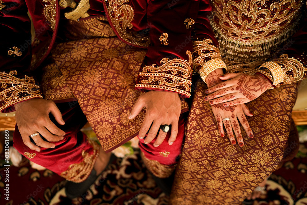 Indonesian traditional wedding outfits with elaborate gold embroidery ...