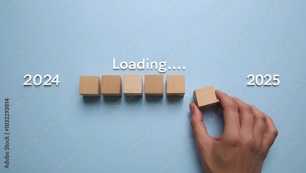 2025 loading, 2024 to 2025 loading wooden bar. A hand places wooden ...