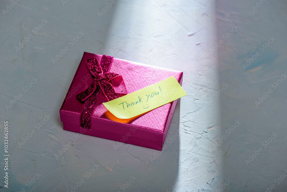 Gift box with a thank you note on a textured surface. Stock Photo ...