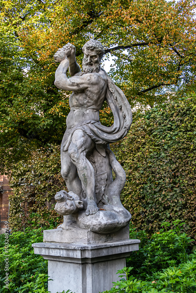 Group of four statues consists of three times a scene with Hercules and ...