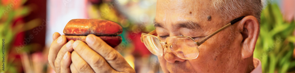 Spiritual senior old man holding yin yang fortune telling wood, concept ...
