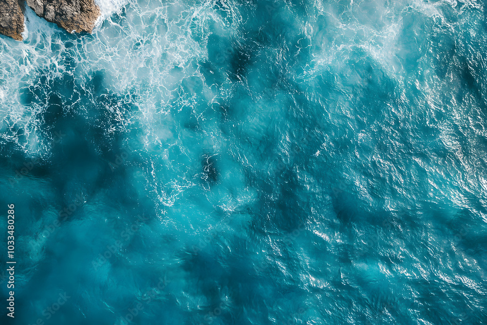 Aerial view of a turquoise water surface texture in a flat lay shot ...