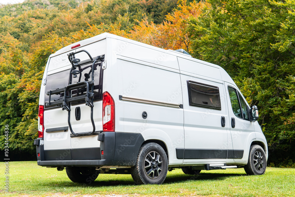 camper tourism a white camper van camped in freedom in a forest with ...